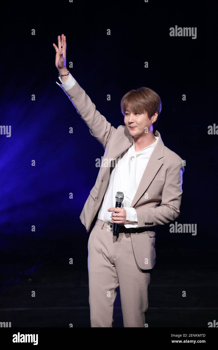 South Korean singer Shin Hye-sung of Korean boy group Shinhwa interacts ...
