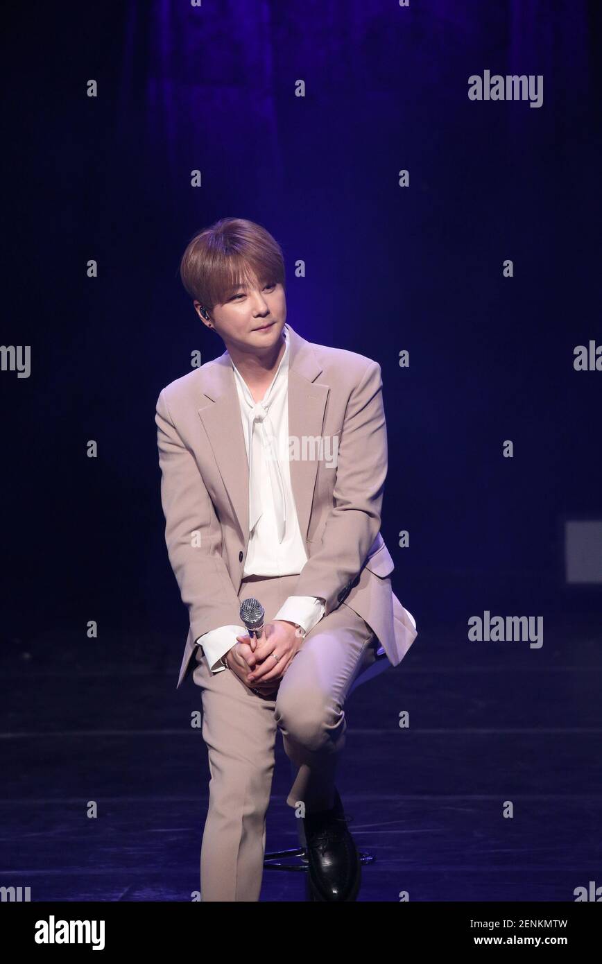 South Korean singer Shin Hye-sung of Korean boy group Shinhwa interacts ...