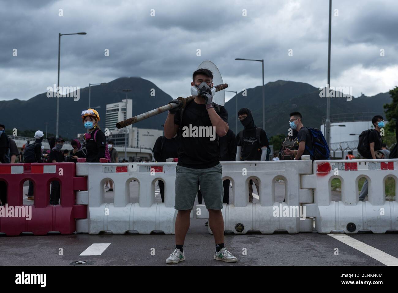 Protesters use water barricades to hinder police advances during the ...