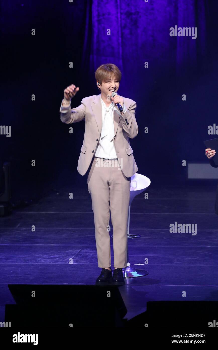 South Korean singer Shin Hye-sung of Korean boy group Shinhwa interacts ...
