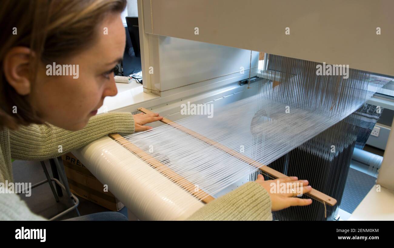 Student weaving with loom Stock Photo - Alamy
