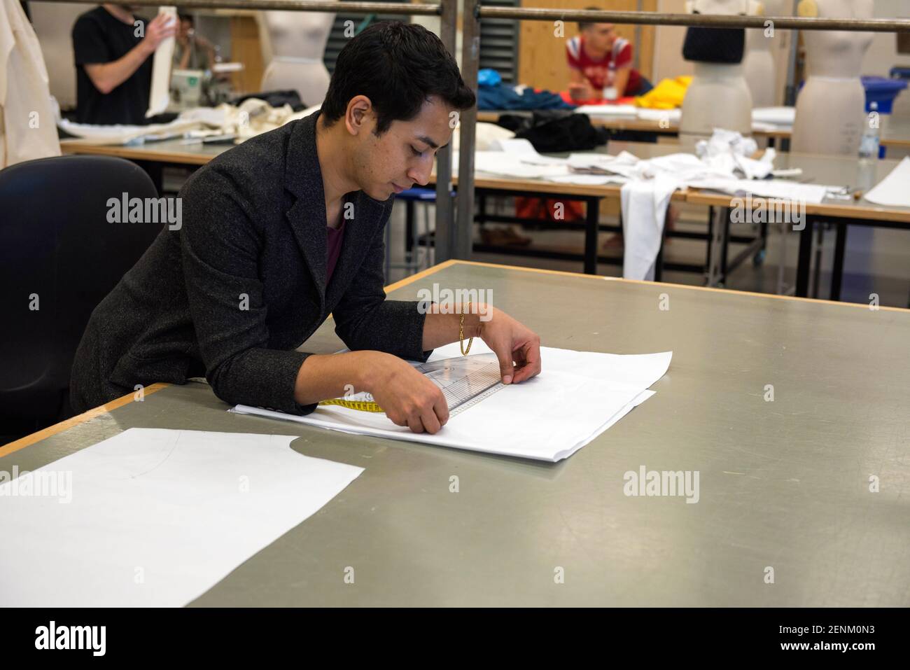 Fashion student working on design Stock Photo - Alamy