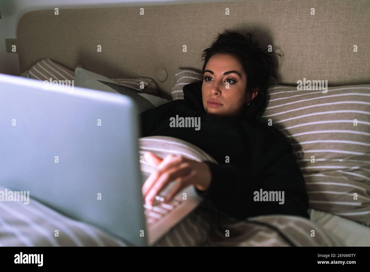 Working on laptop while reclining hi-res stock photography and images ...