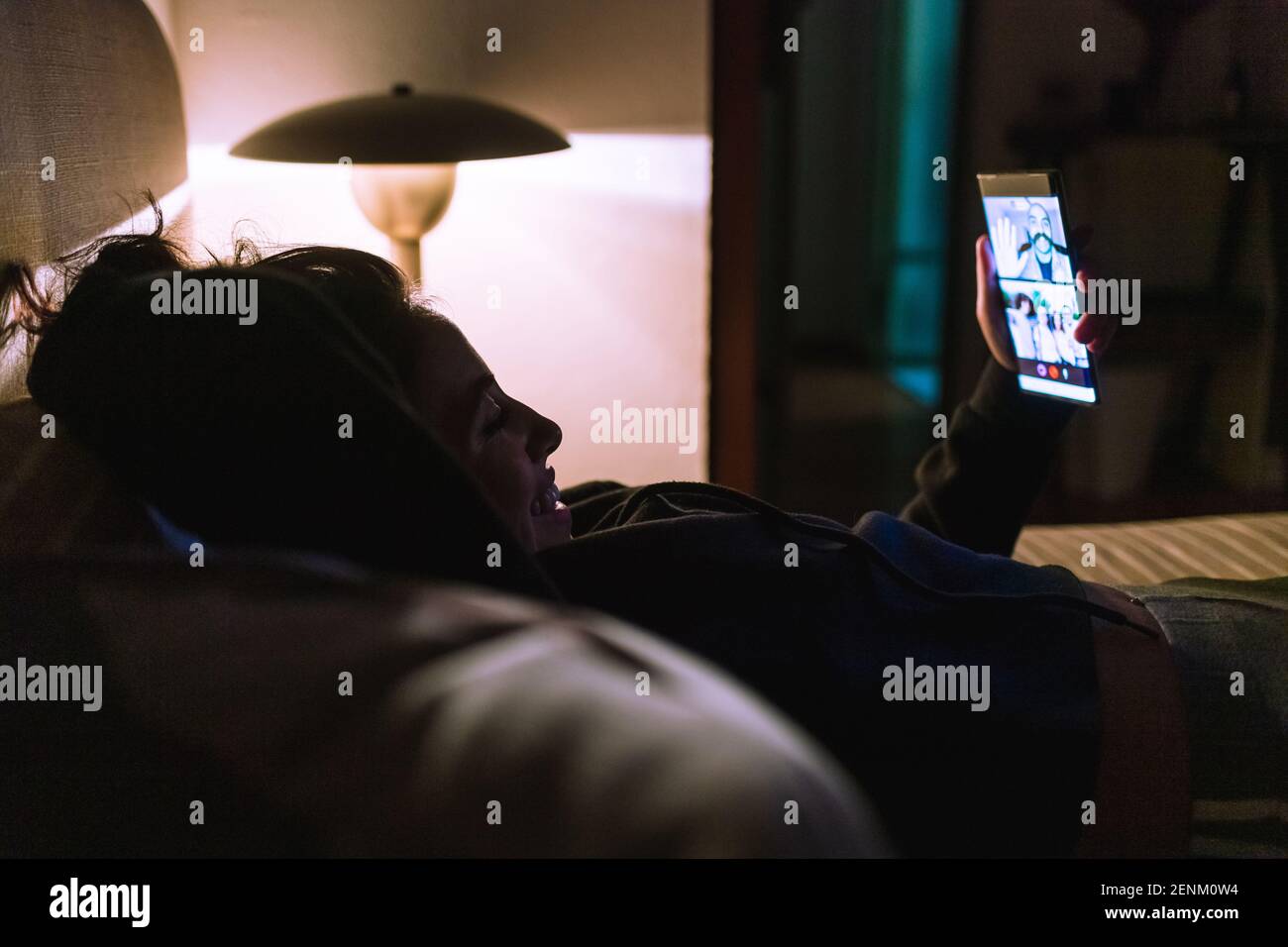 Woman having video call with friends Stock Photo - Alamy