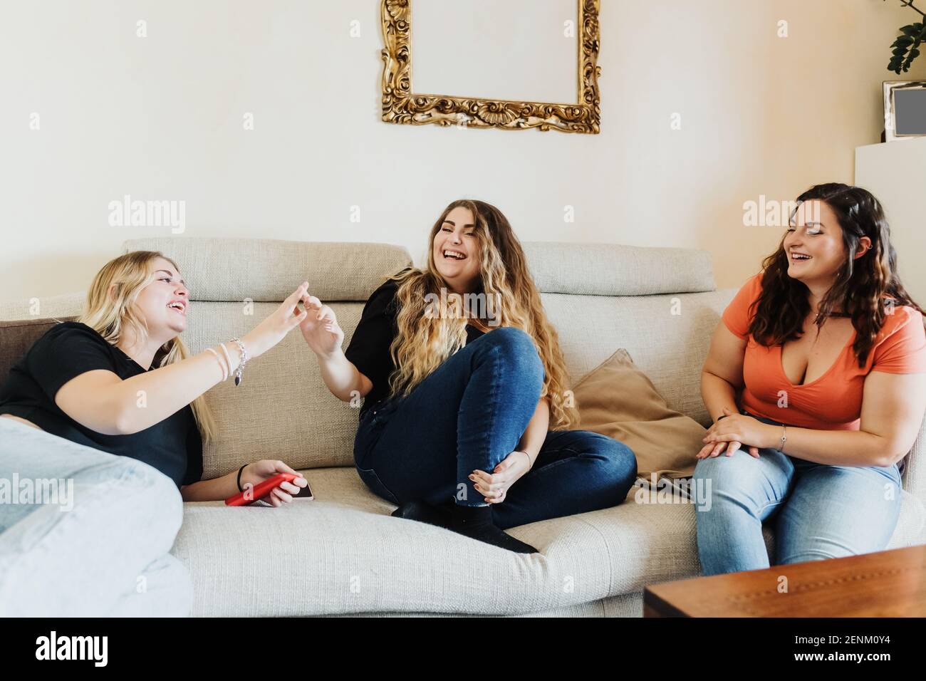 Female friends relaxing at home Stock Photo - Alamy