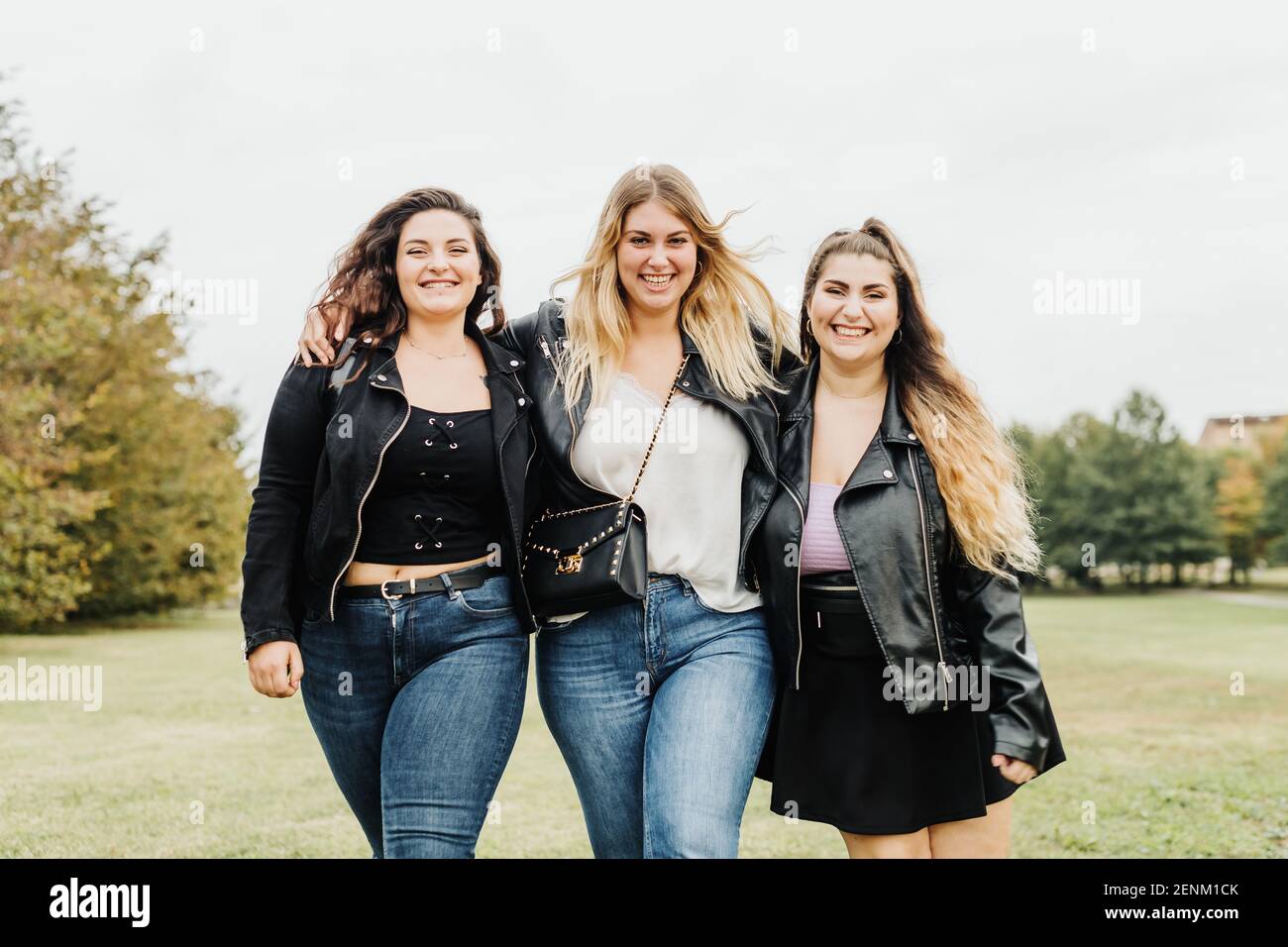 Female friends together outdoors Stock Photo - Alamy