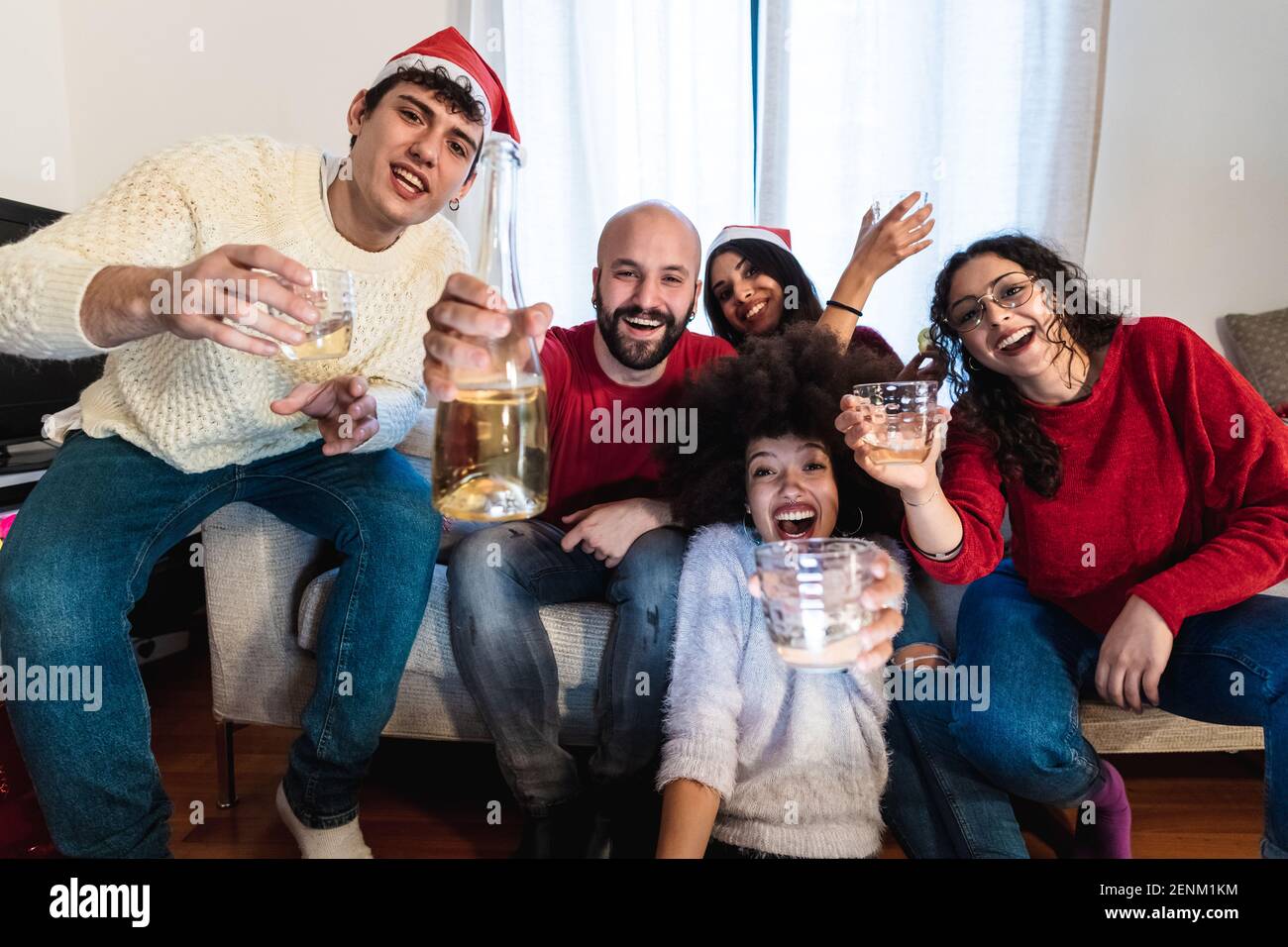 Friends raising a toast with drinks, video call Stock Photo - Alamy
