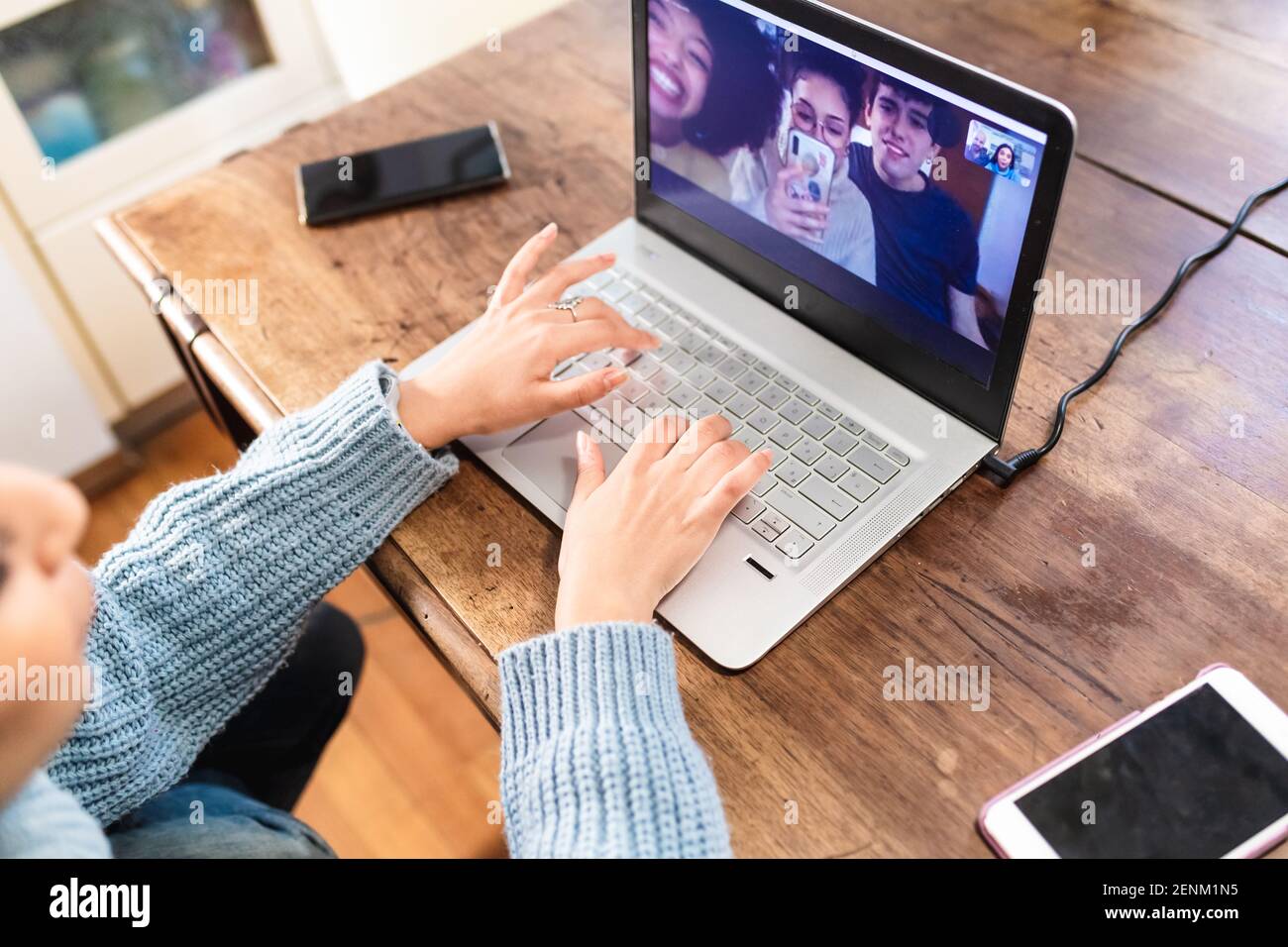Young woman having video call with friends on Stock Photo - Alamy