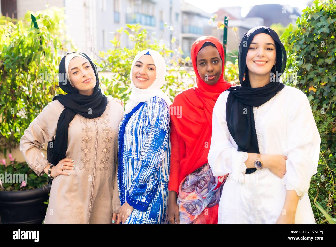 Four young muslim women in garden Stock Photo - Alamy