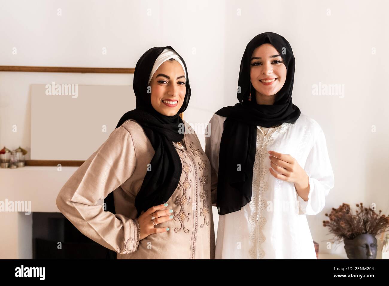 Portrait of female friends wearing hijab Stock Photo - Alamy
