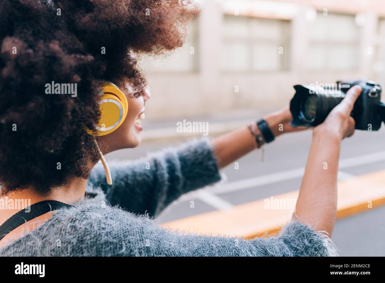 Photographer with camera outdoors Stock Photo - Alamy