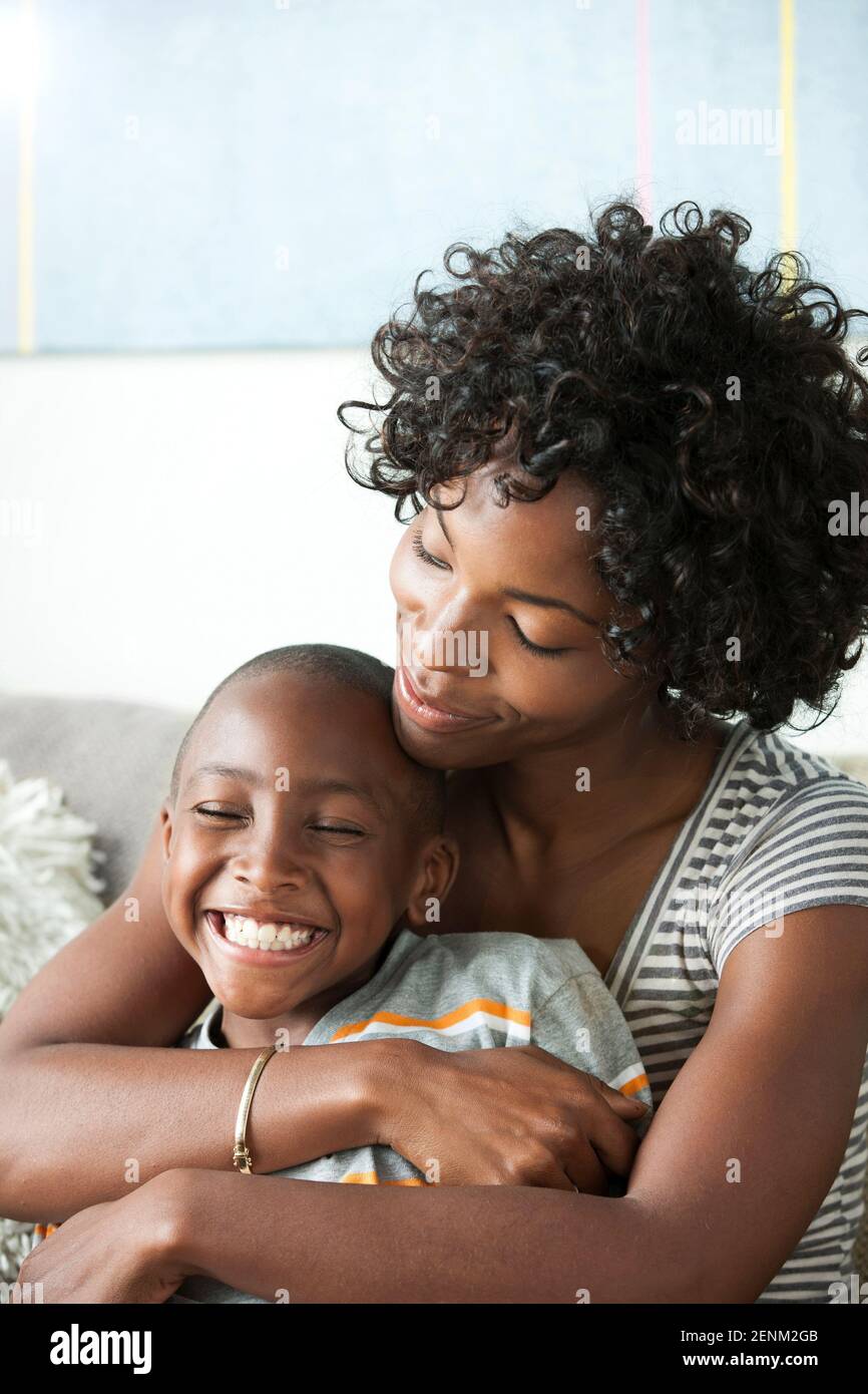 Portrait of mother hugging son Stock Photo - Alamy
