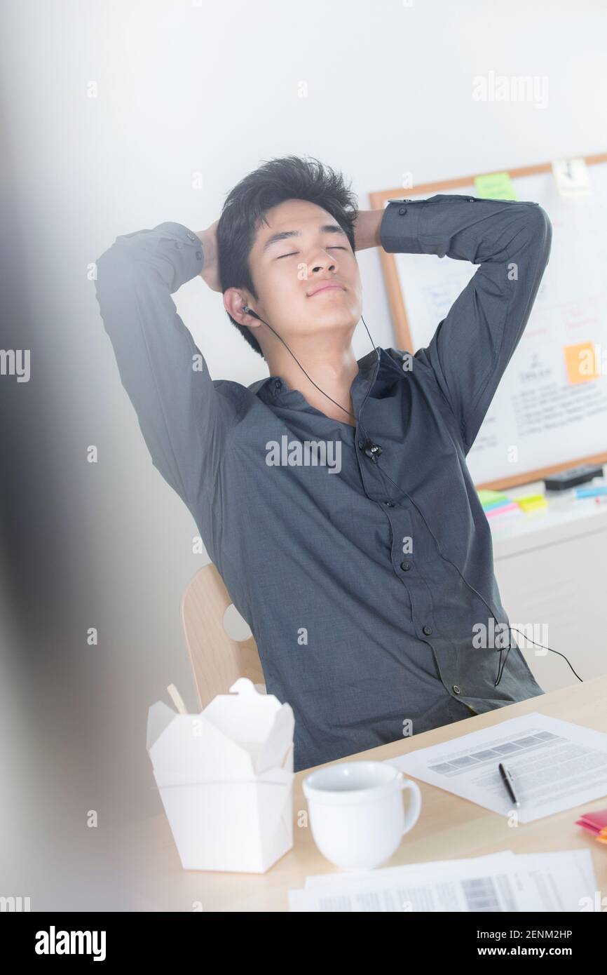 Portrait of male office worker relaxing and Stock Photo - Alamy