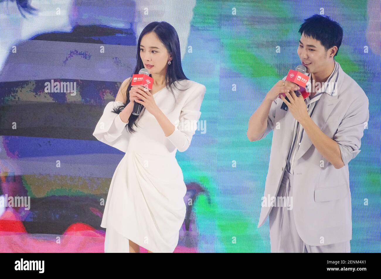 Chinese actress and singer Yang Mi, left, attends Colgate promotional ...