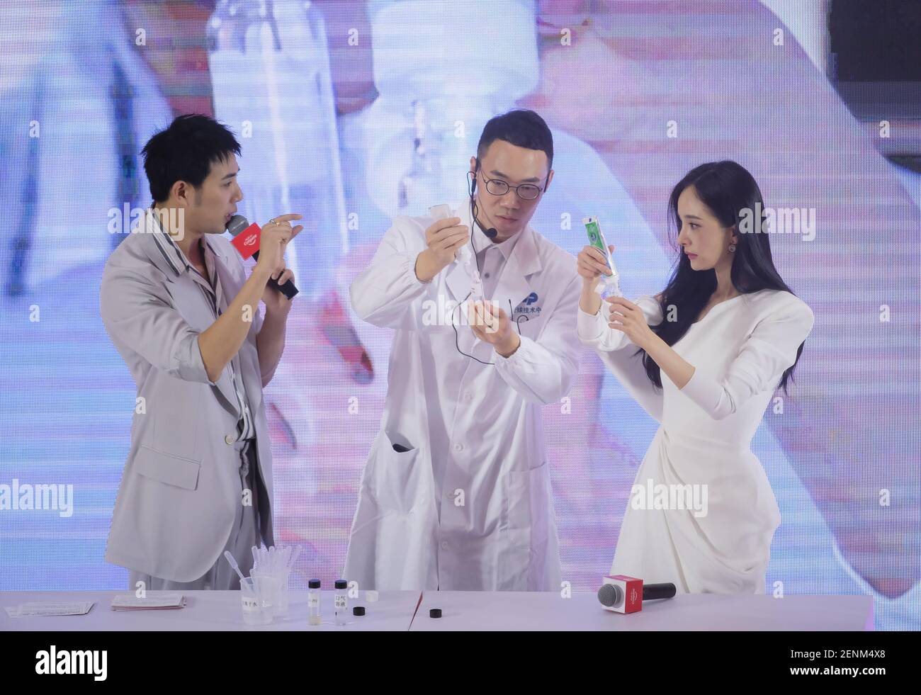 Chinese actress and singer Yang Mi, right, attends Colgate promotional ...