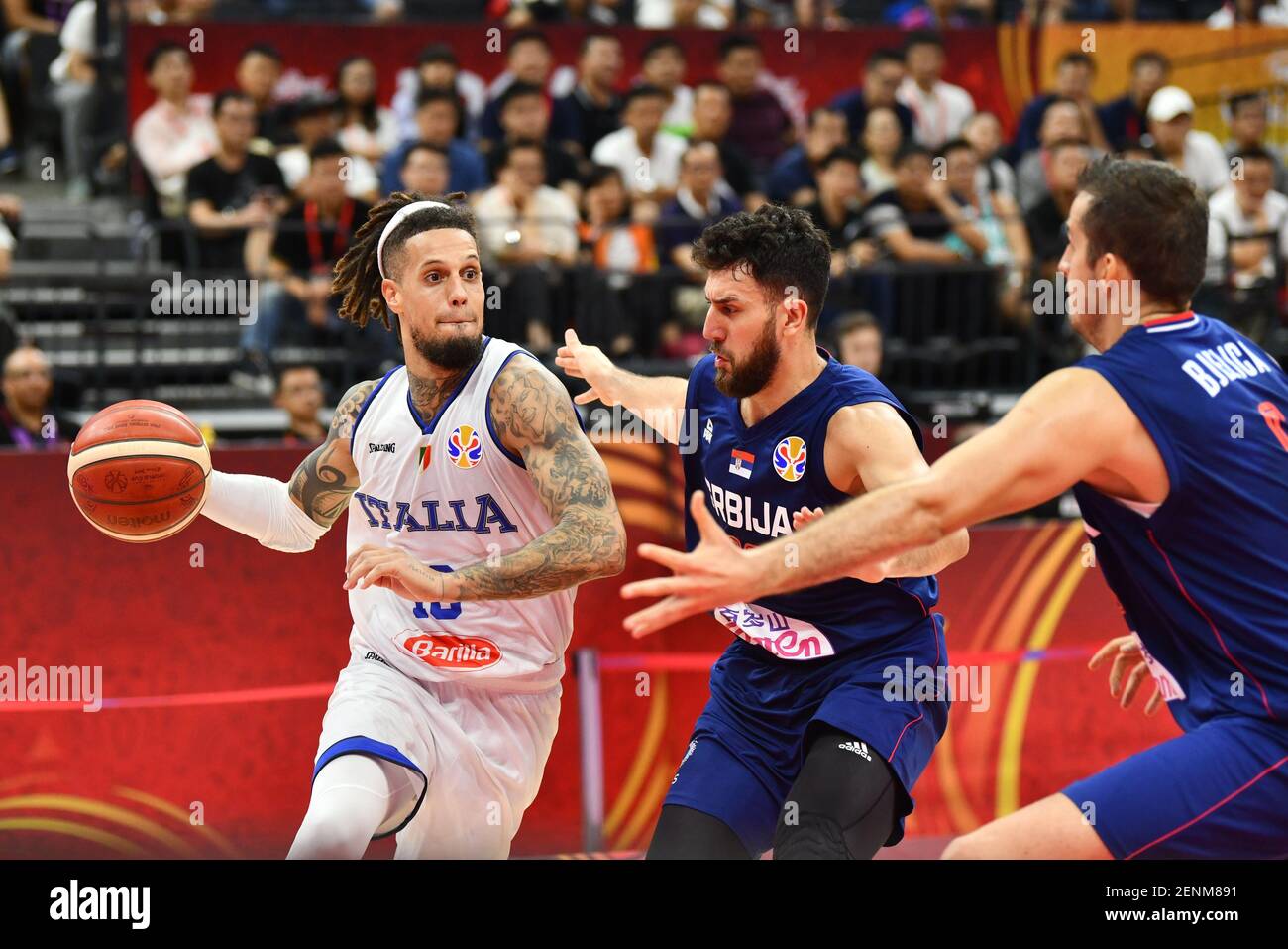 Daniel HACKETT, left, of Italy challenges Vasilije MICIC, center, and ...