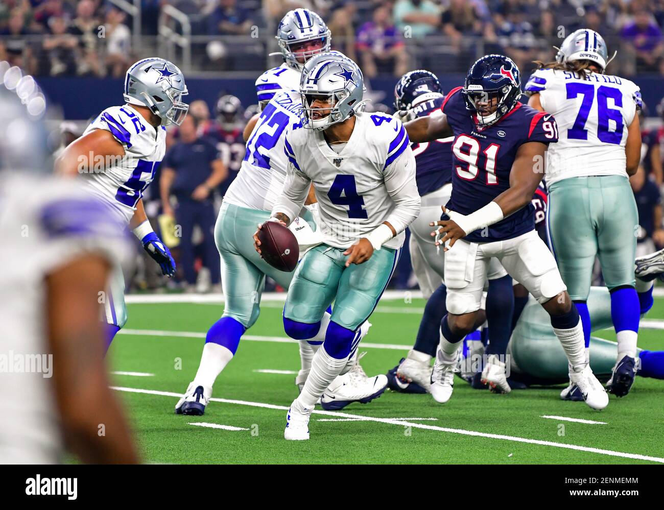 August 24th, 2019:.Dallas Cowboys quarterback Dak Prescott (4) rolls out and throws a pass for a ...