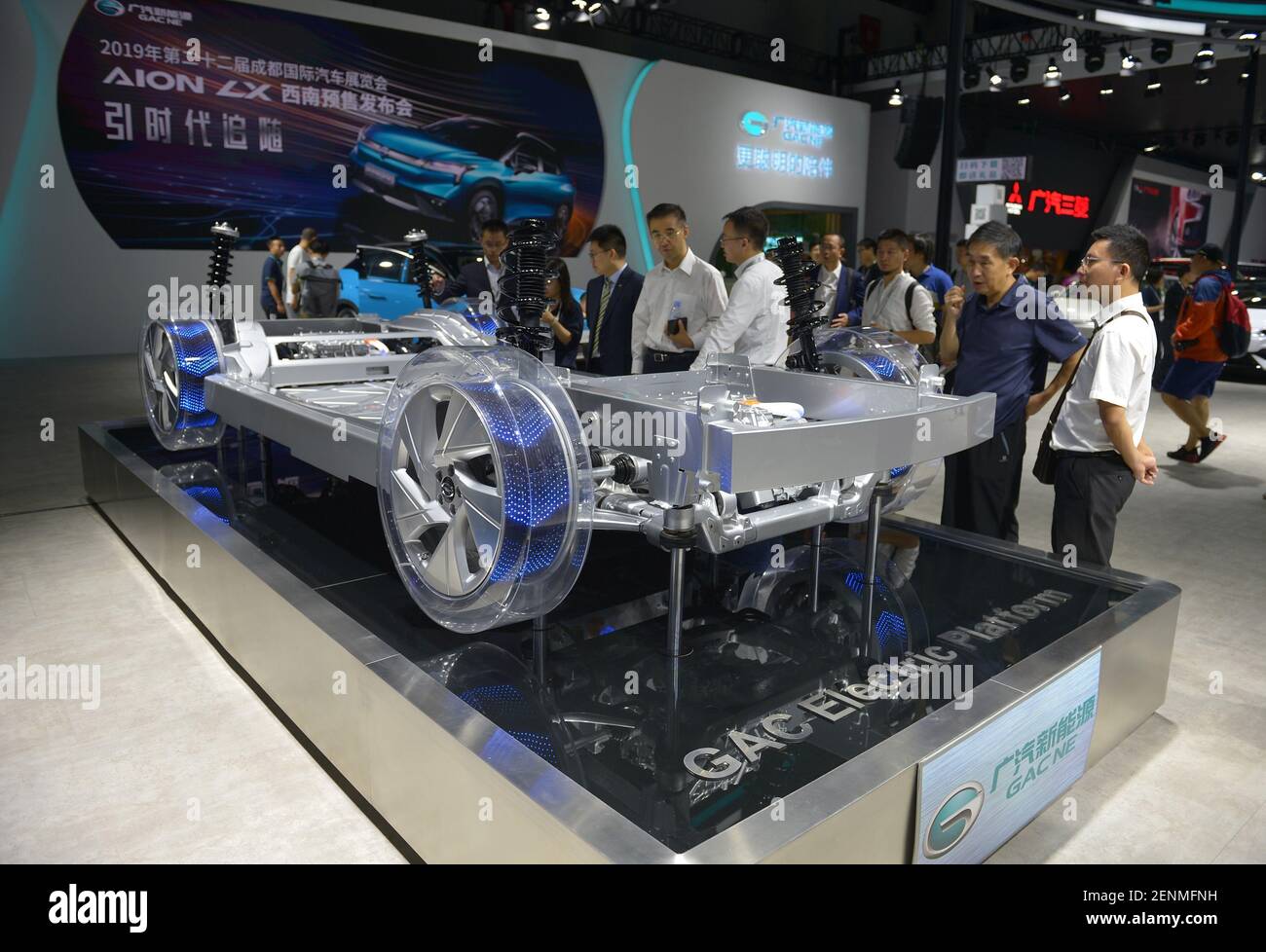 People look at a car chassis at the 2019 22th International Auto Show ...