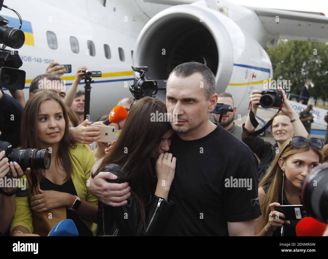 Ukrainian film director Oleg Sentsov hugs his daughter Alina Sentsova ...