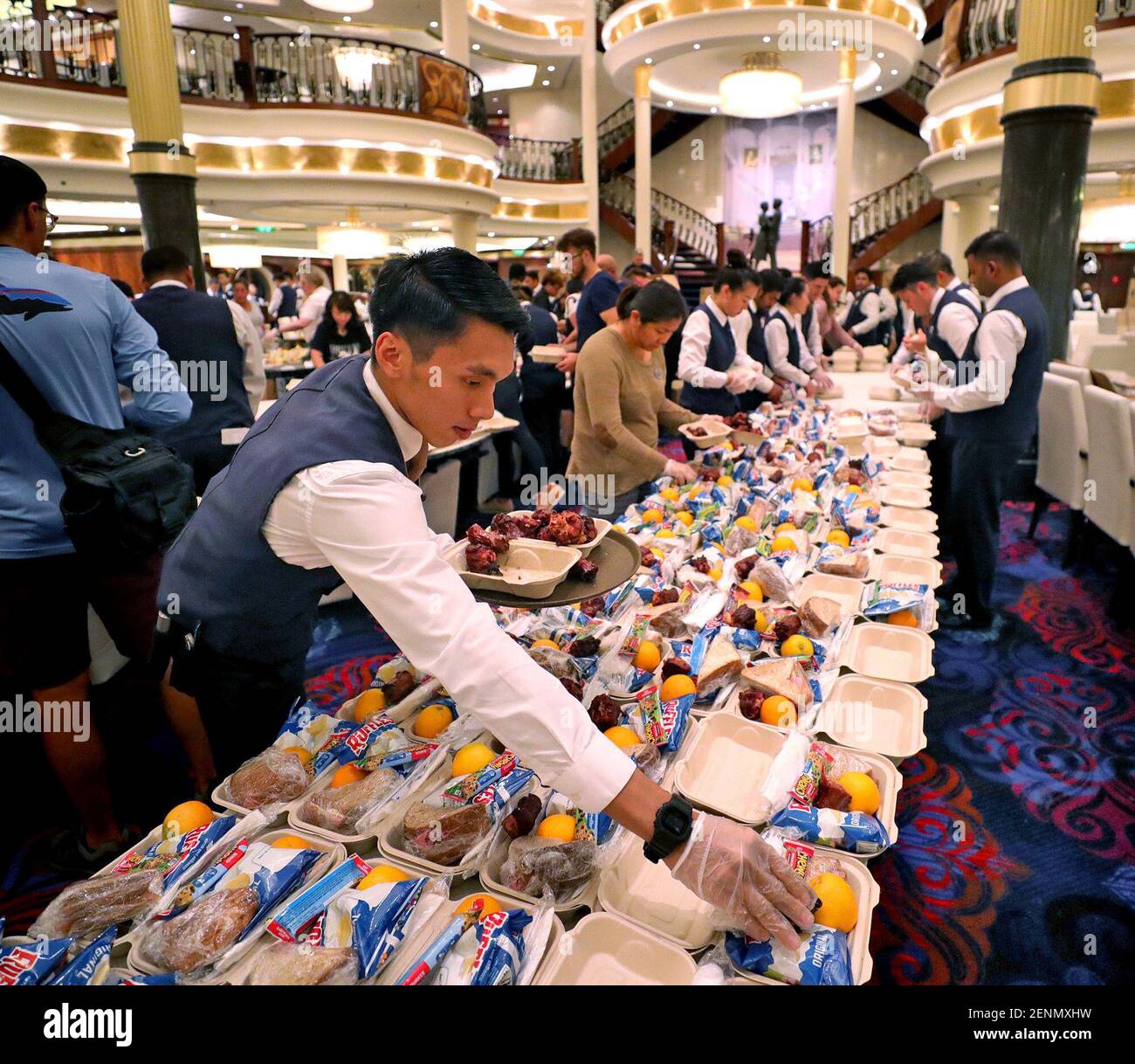 Crew members on Royal Caribbean's Mariner of the Seas convert the ...