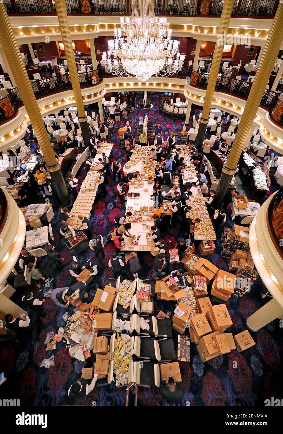 Crew members on Royal Caribbean's Mariner of the Seas convert the ...