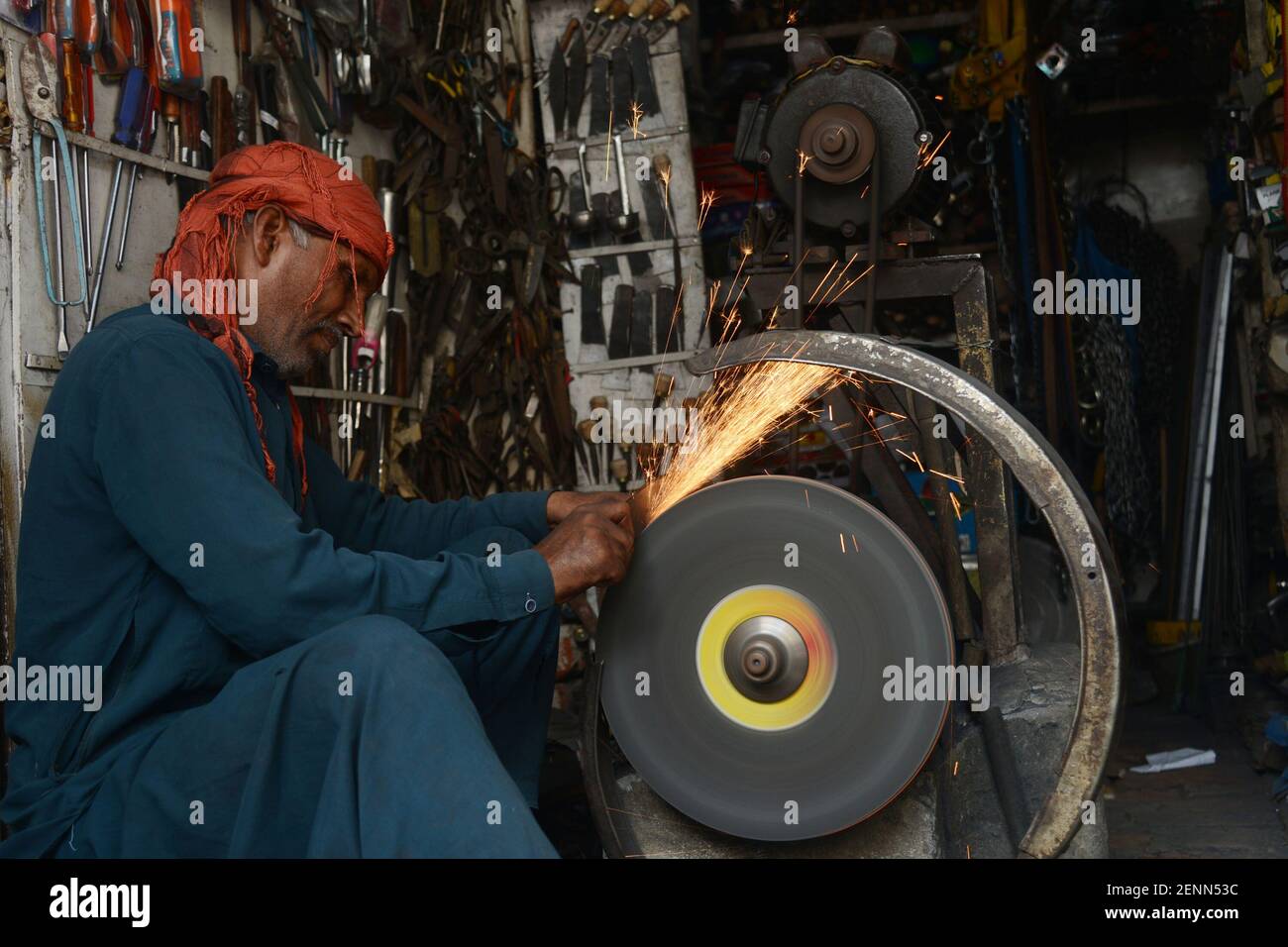 Pakistani Shiite Muslim select knives attached to chains that are used ...