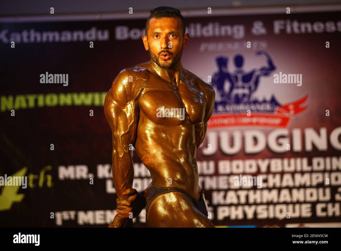 A contestant poses in the pre-judging round of the 4th Mr Kathmandu ...