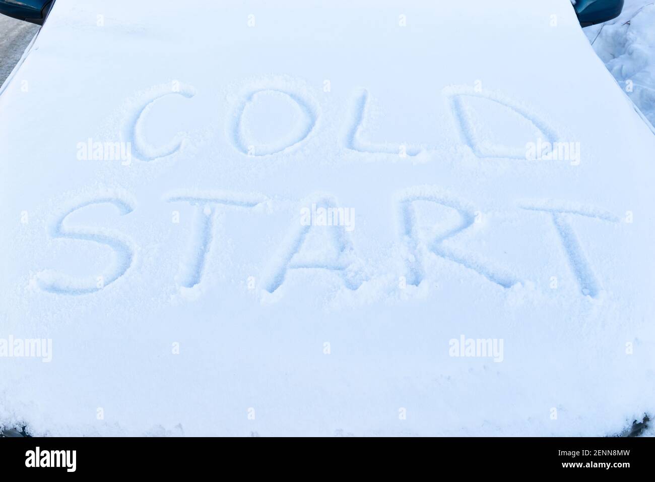 the inscription on the hood of a frozen broken car covered with snow ...