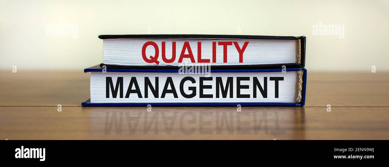 Quality management symbol. Concept words 'Quality management' on books ...