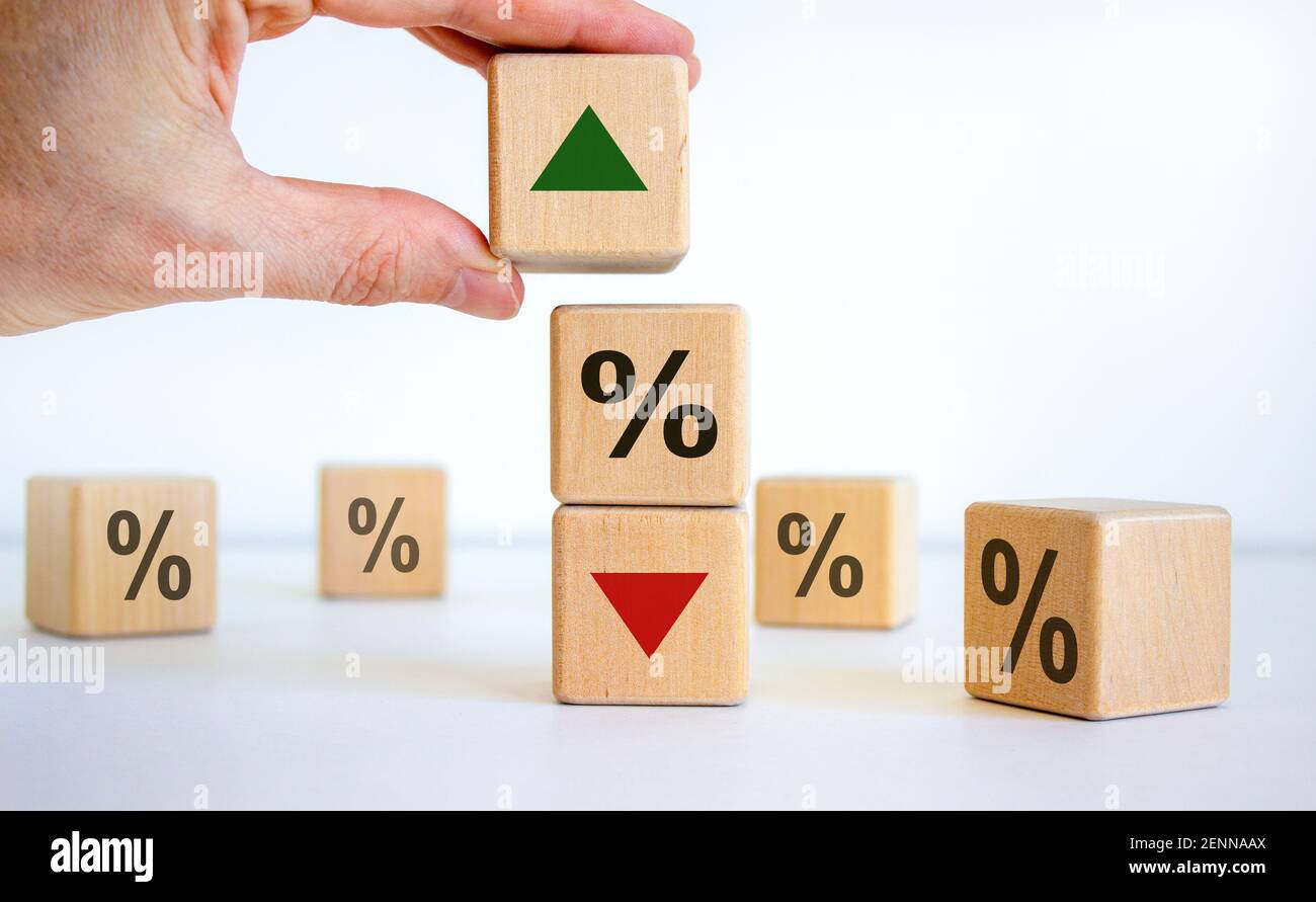 Interest rates symbol. Wooden cubes, businessman changed the direction ...
