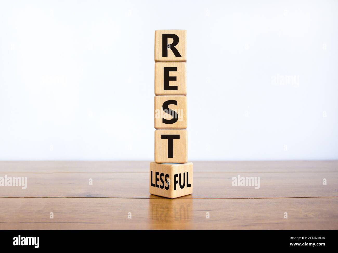 Restless or restful symbol. Turned the wooden cube, changed the word ...