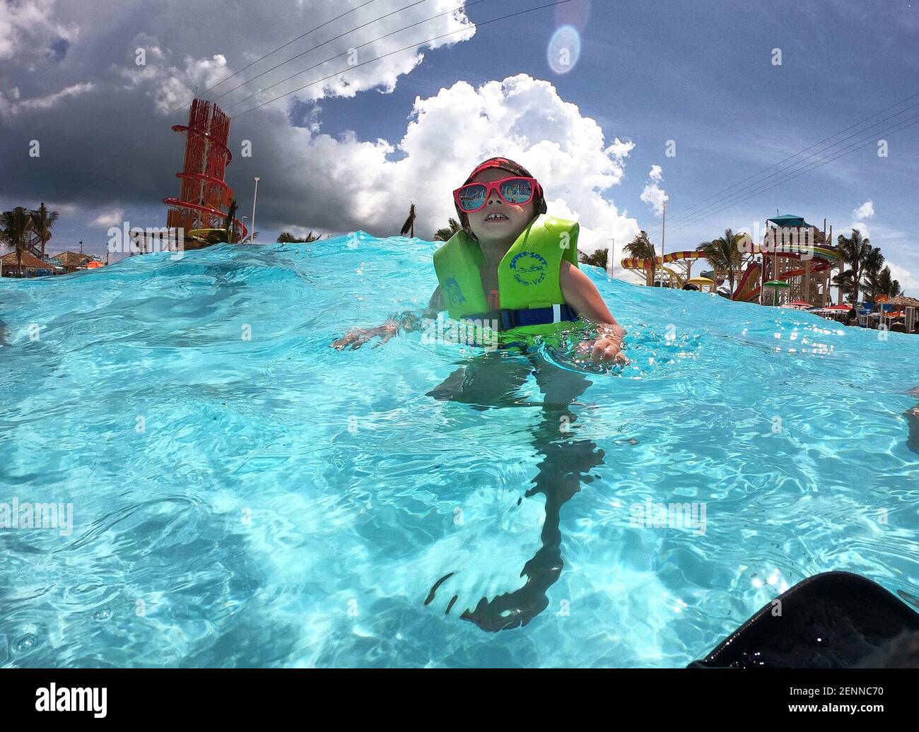 A young guest enjoys the wave pool at Coco Cay, the private island for ...