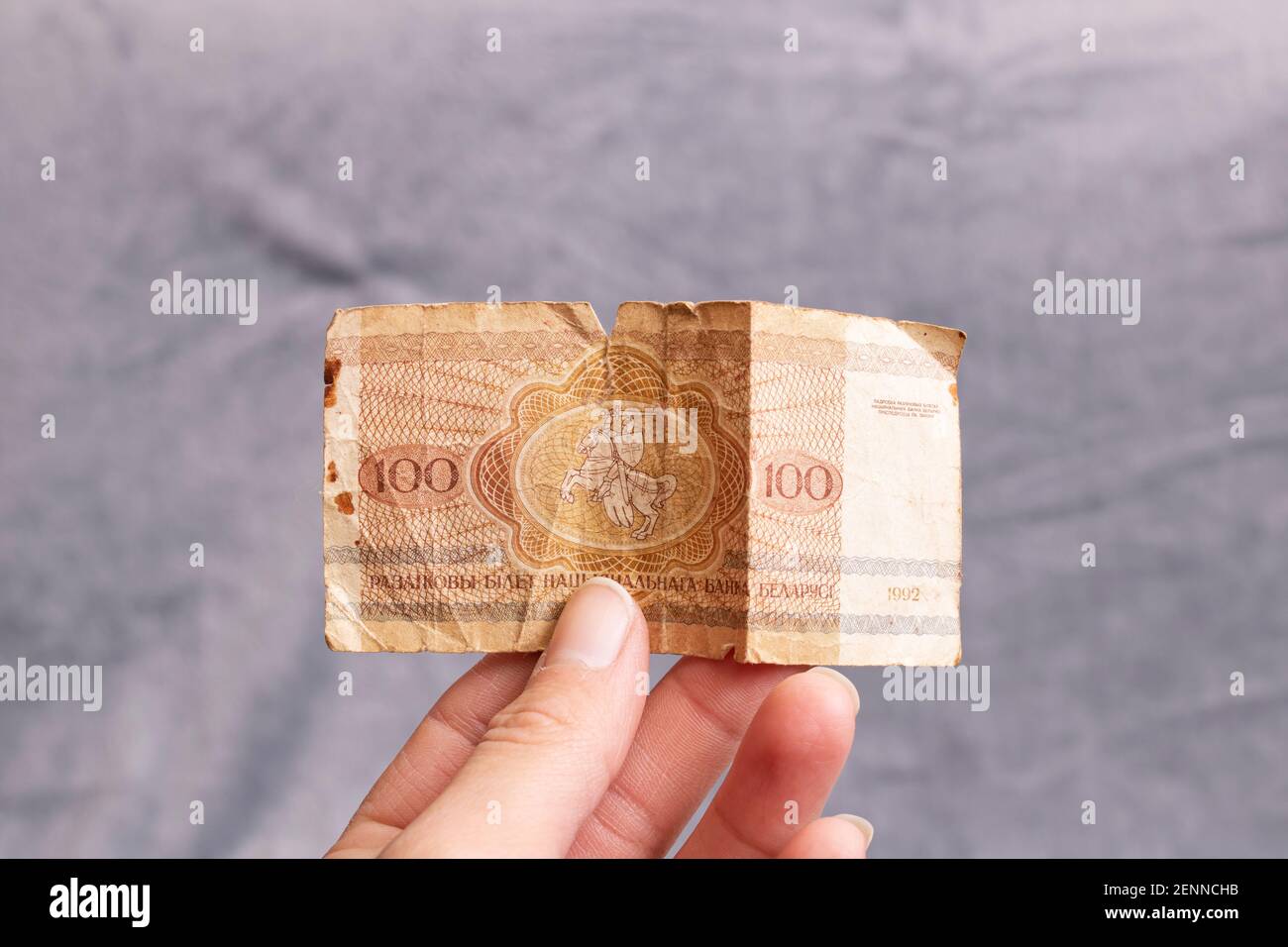Old Belarus bill in hand on gray background close up Stock Photo - Alamy