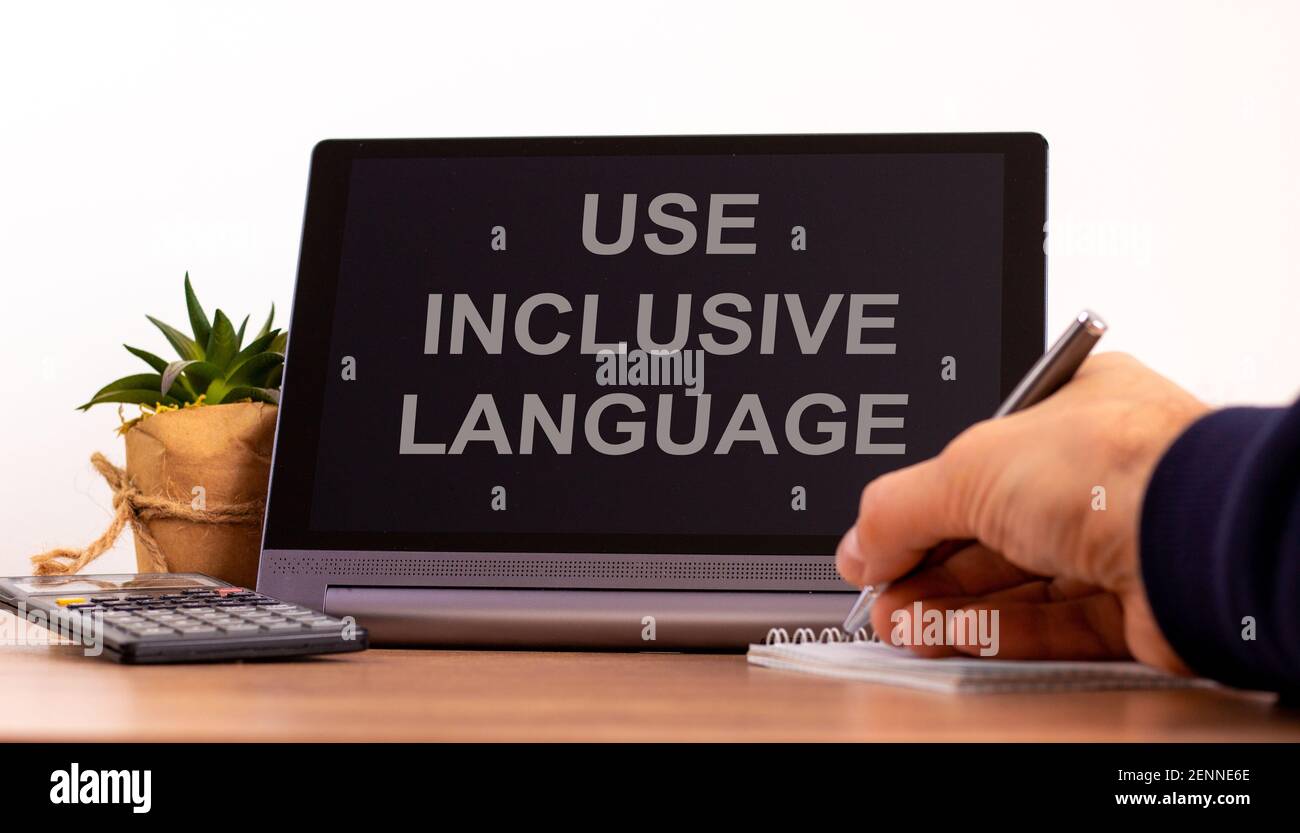 Use inclusive language symbol. Tablet with words 'Use inclusive ...