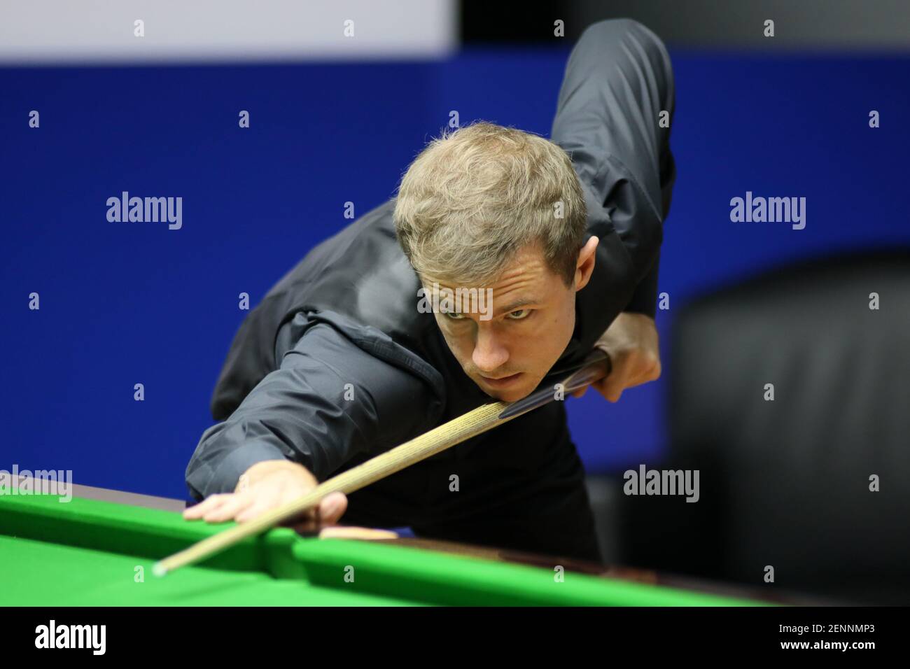Jack Lisowski of England plays a shot to Mark Selby of England at the ...