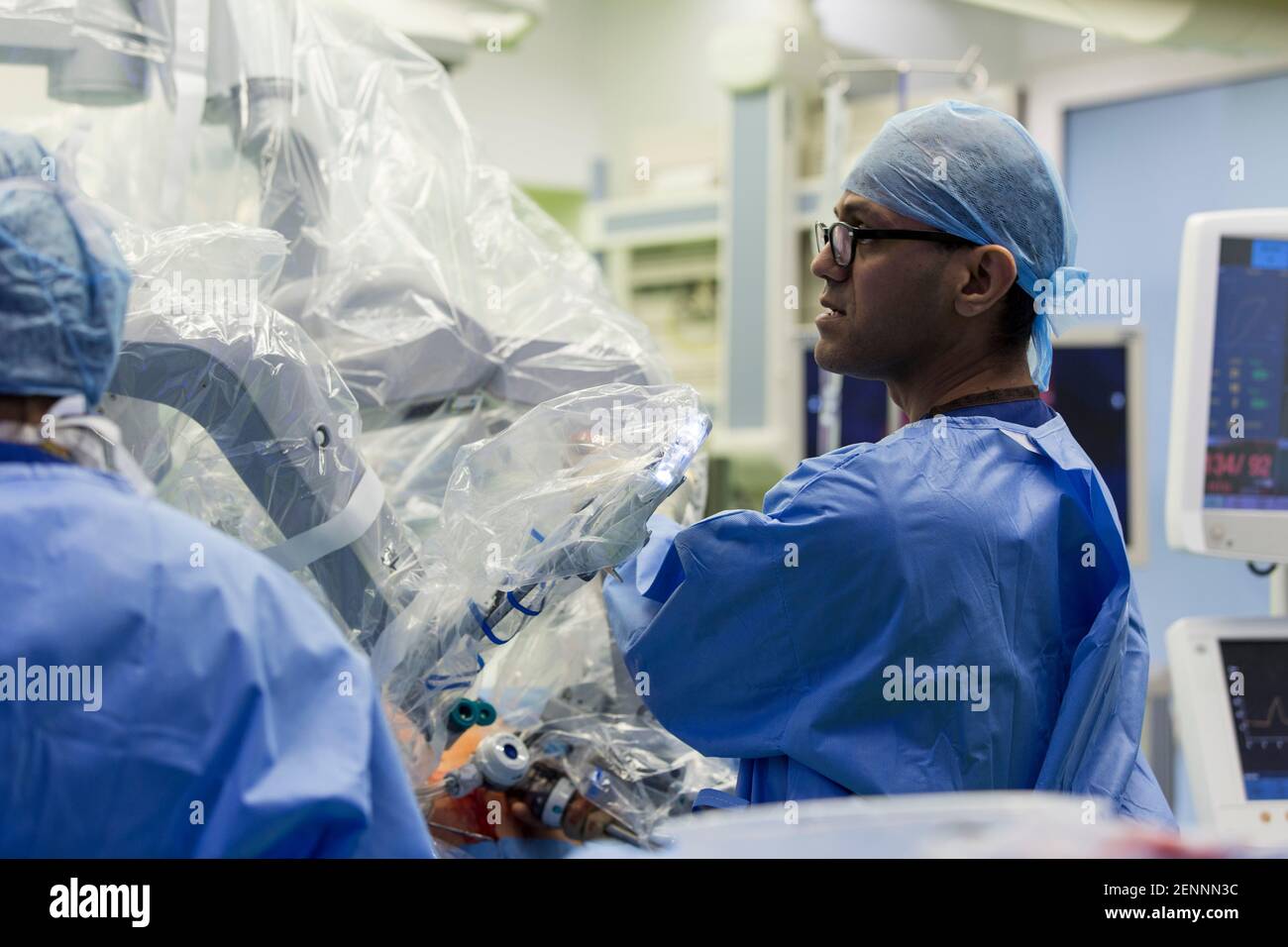 Doctors & Surgeons perform operation Stock Photo - Alamy