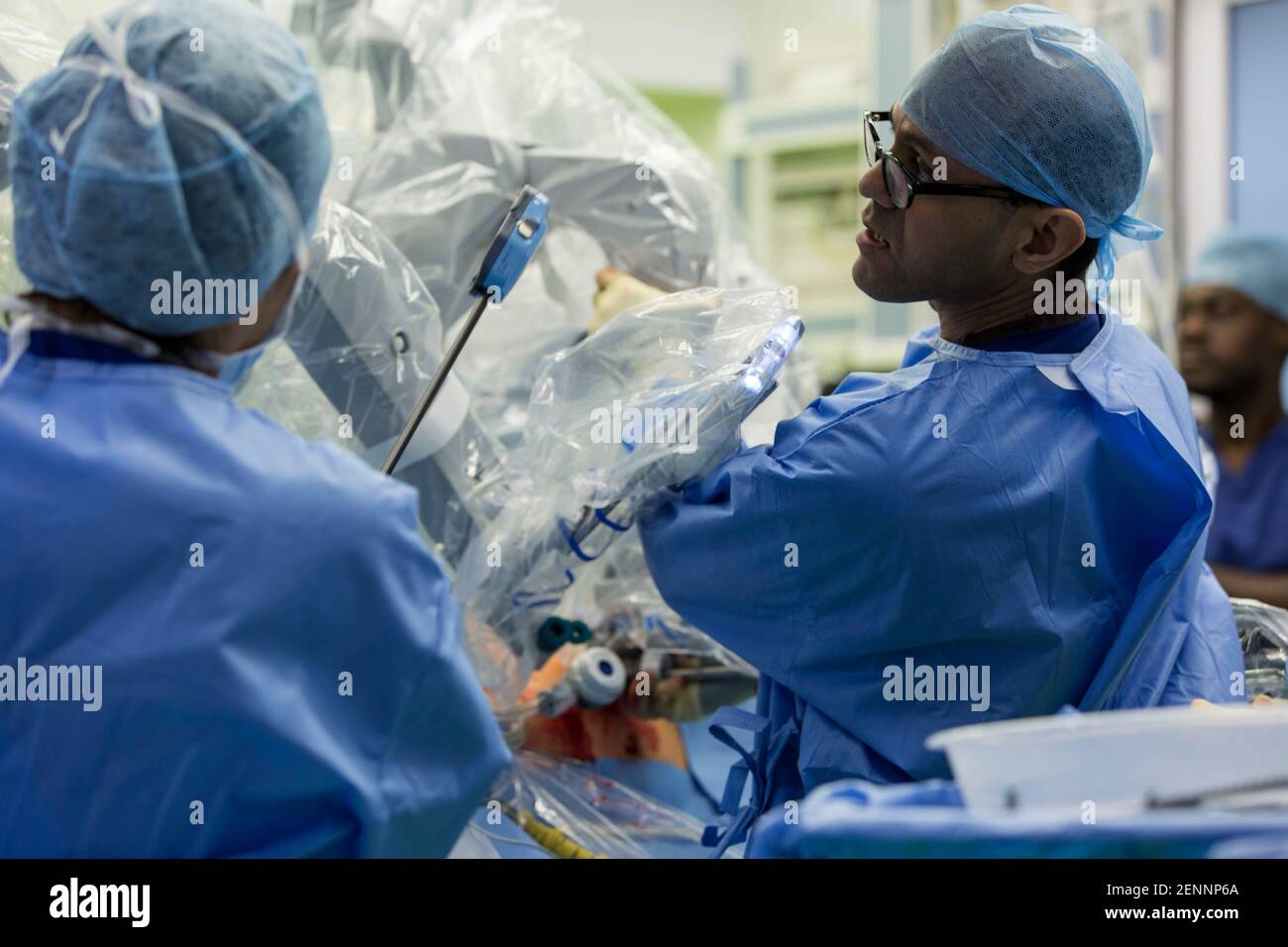 Doctors & Surgeons perform operation Stock Photo - Alamy