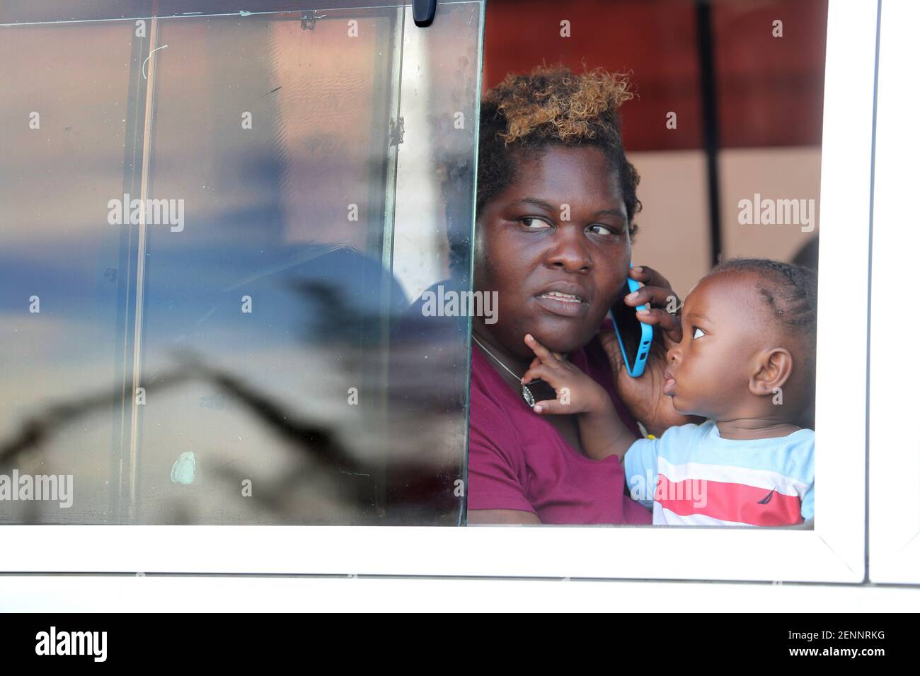 Arsharie Demeritte and her 1-year-old son and husband board a bus at ...