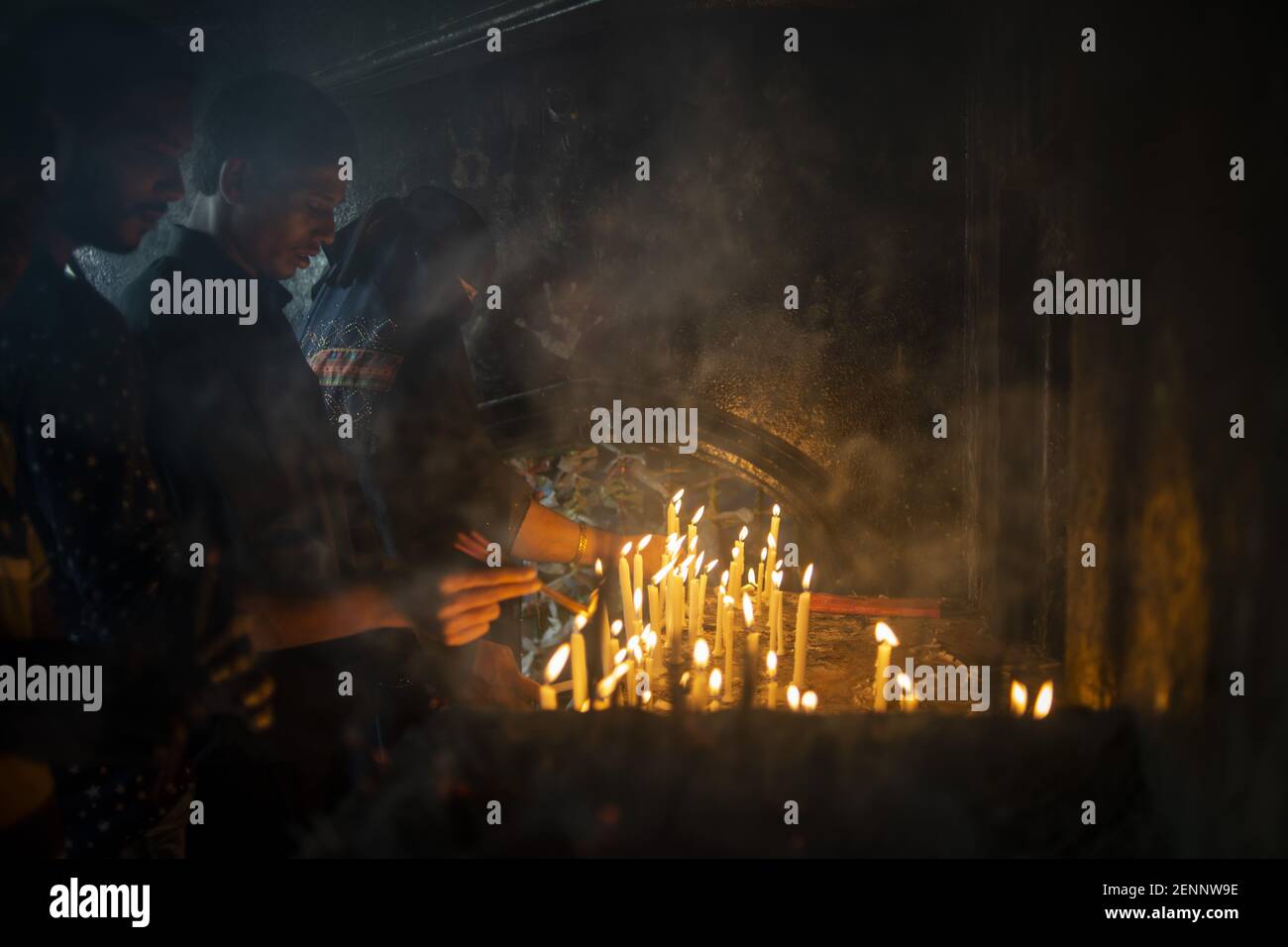Shia Muslims light candles at the Hussaini Dalan during the Ashura day ...