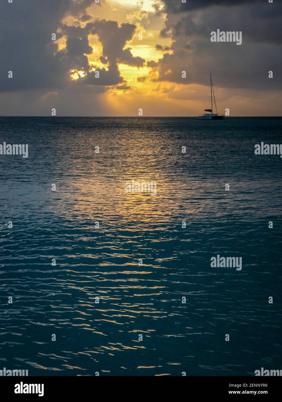 Sunset over ocean on Grand Cayman island Stock Photo - Alamy