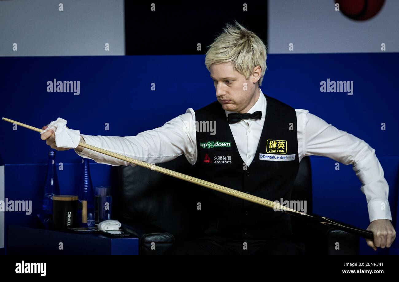 Neil Robertson of Australia wipes his cue druing the matech against ...