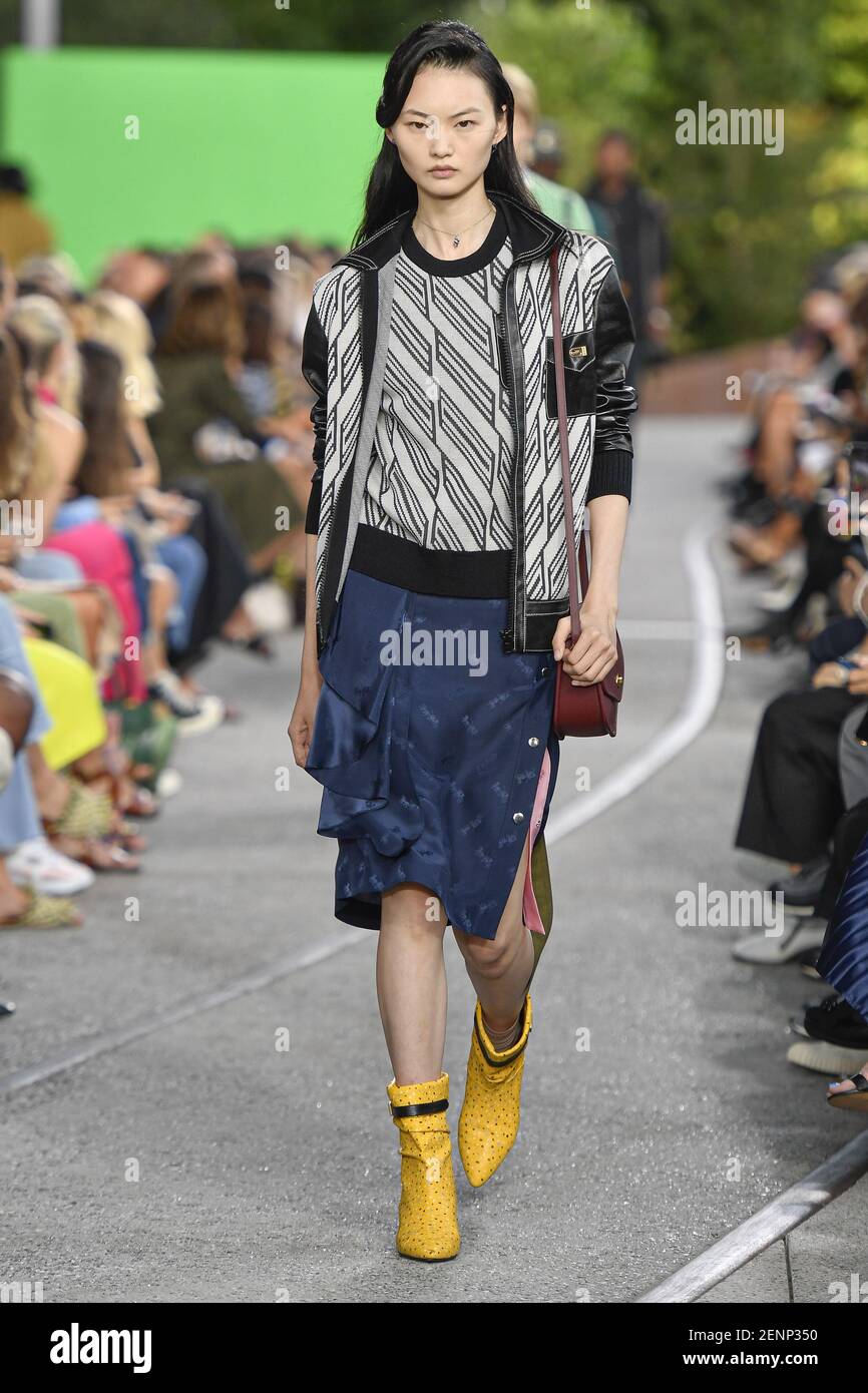 He Cong walking on the runway Coach Fashion Show during New York ...