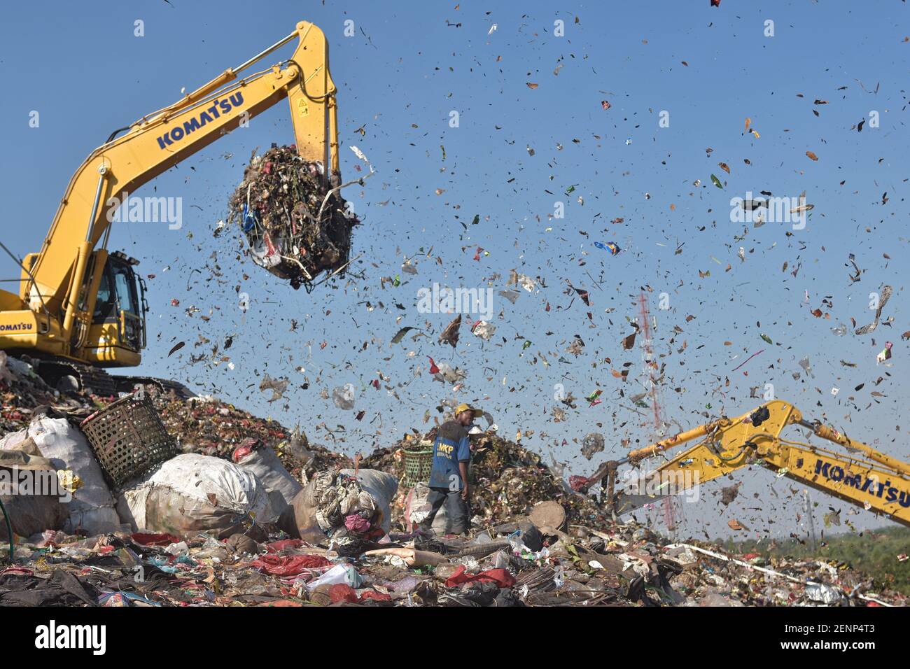 Scavengers sort and collect plastics for recycling at the garbage ...