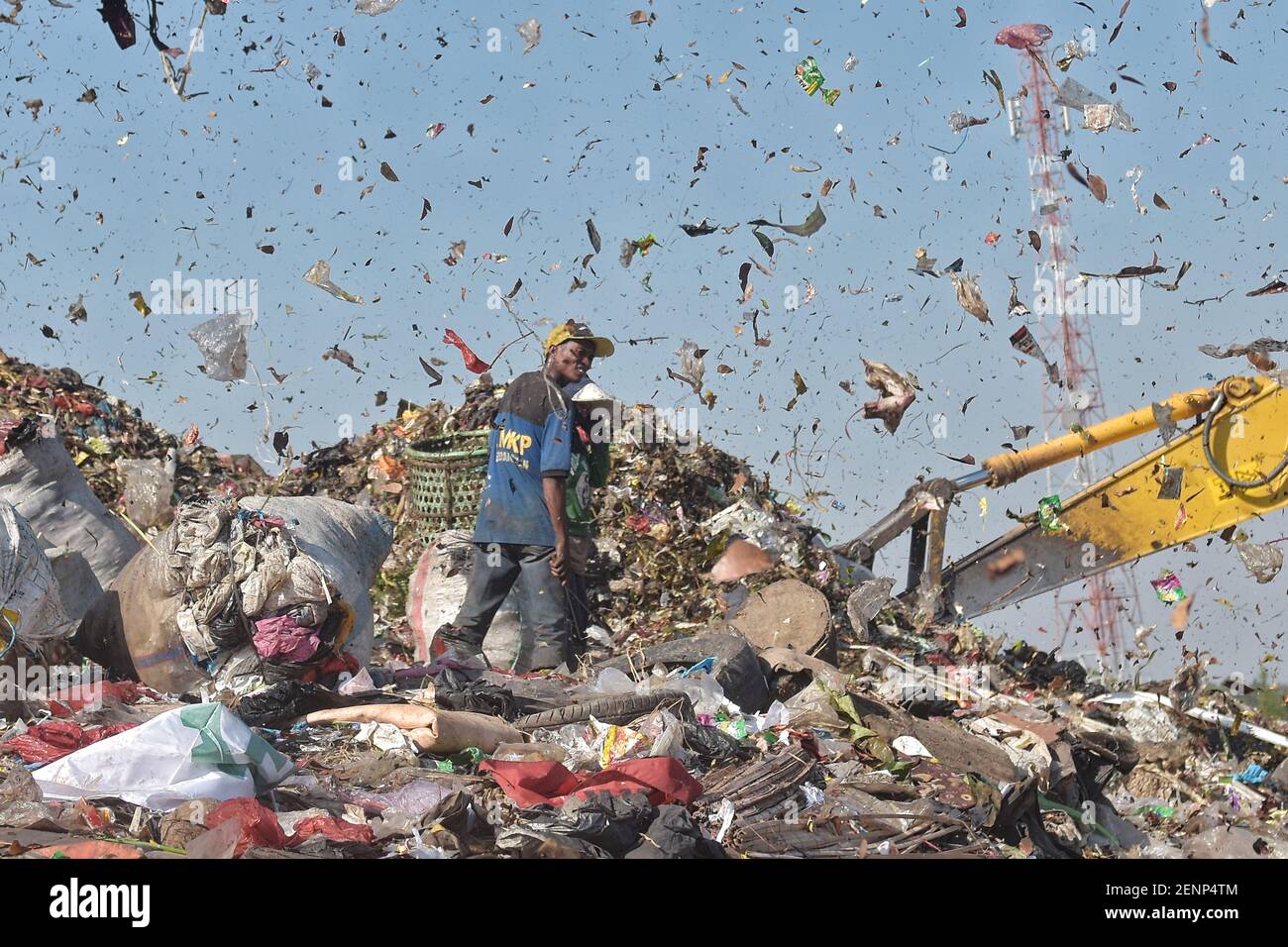 Scavengers sort and collect plastics for recycling at the garbage ...