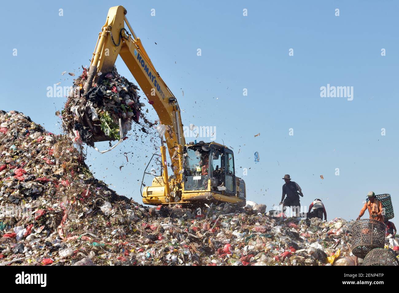 Scavengers sort and collect plastics for recycling at the garbage ...