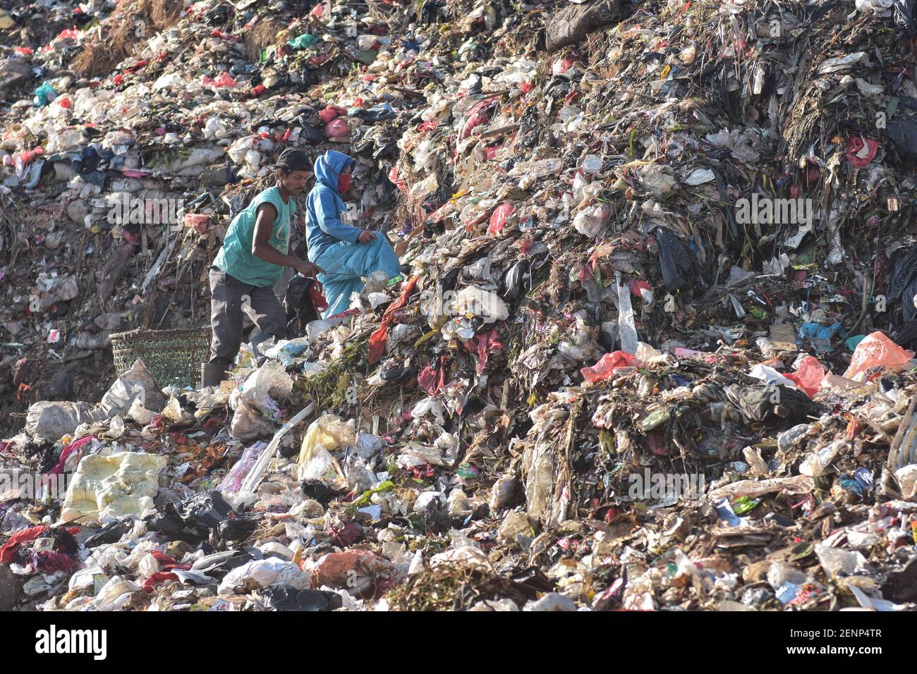 Scavengers sort and collect plastics for recycling at the garbage ...