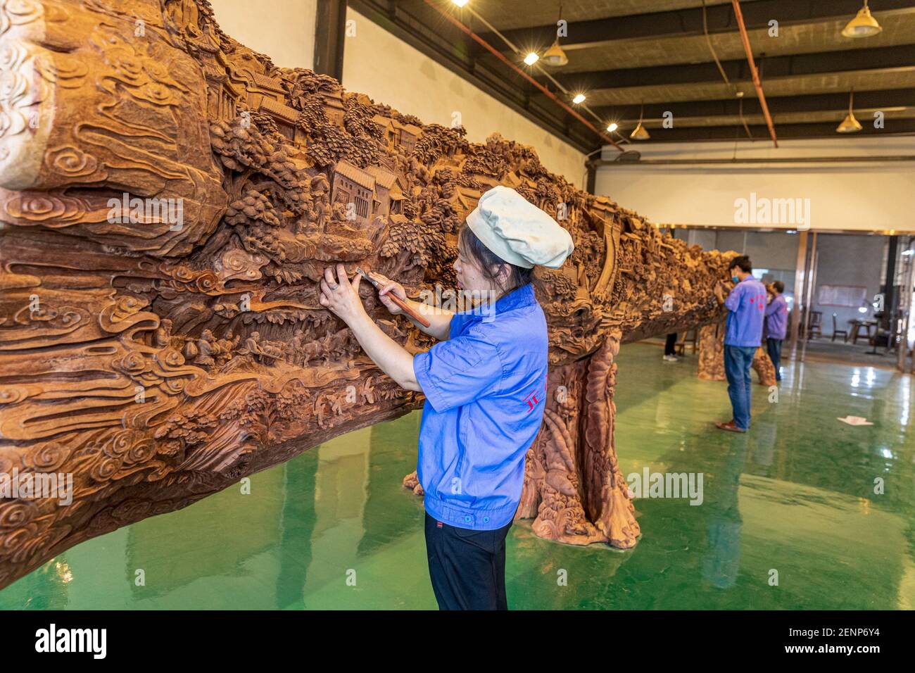 Chinese craftsmen carve the scenes shown in the ancient Chinese ...