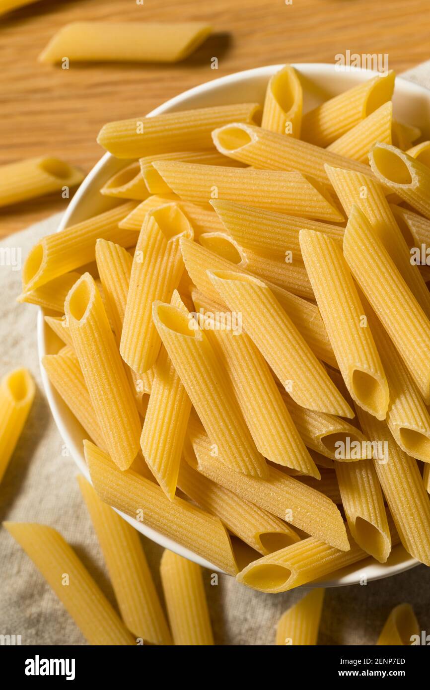 Raw Organic Dry Penne Pasta Ready to Cook Stock Photo - Alamy