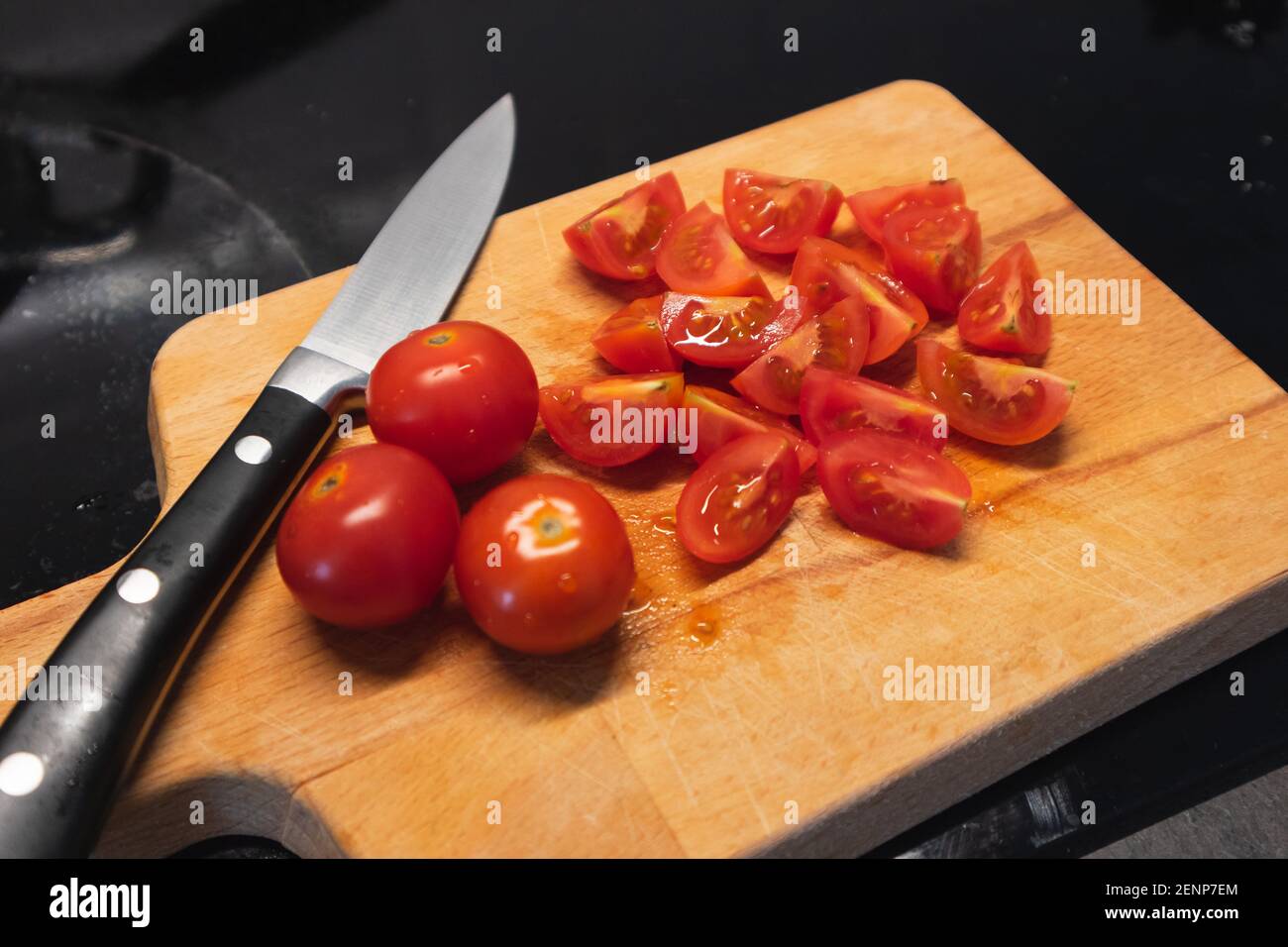 Tomatoes cut in quarters hi-res stock photography and images - Alamy