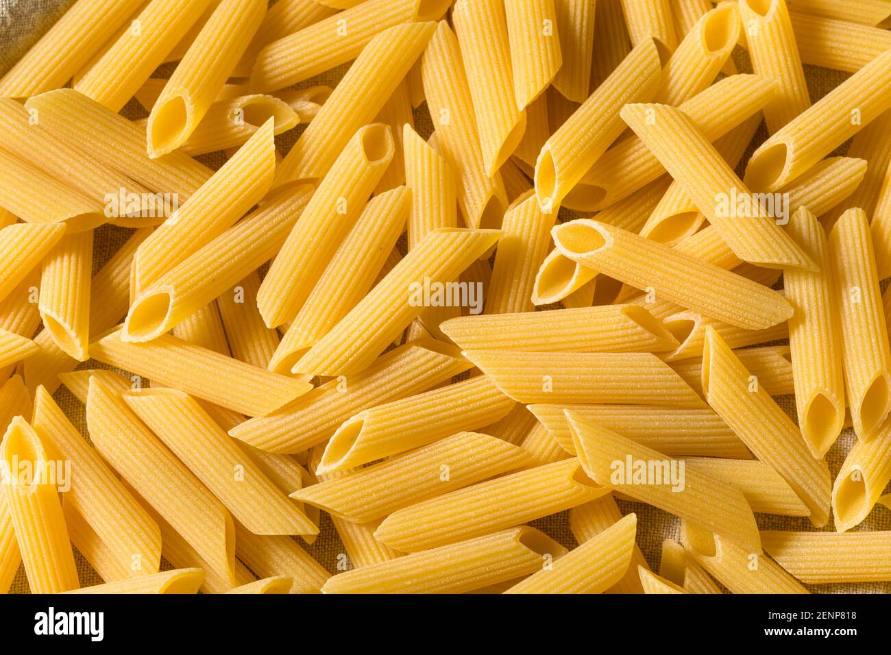 Raw Organic Dry Penne Pasta Ready to Cook Stock Photo - Alamy
